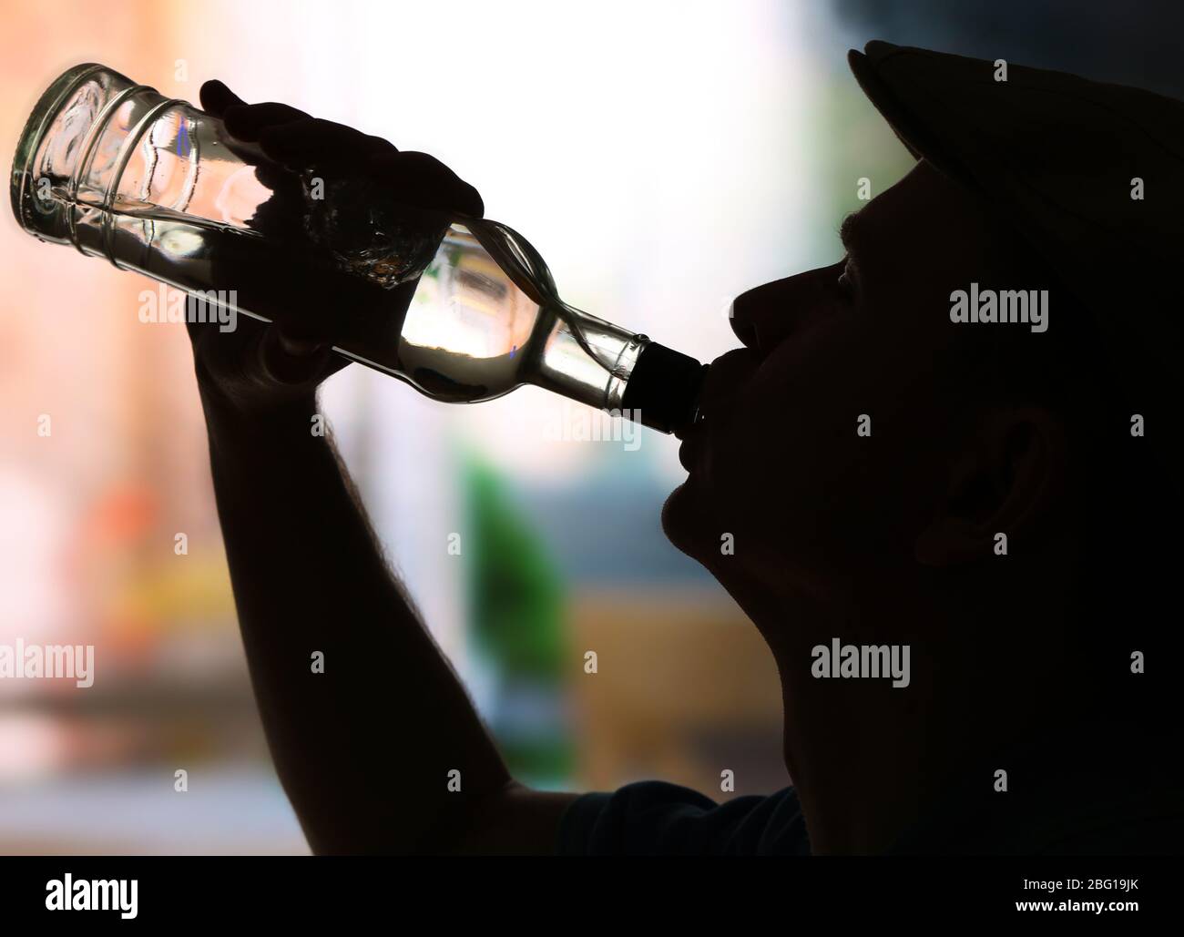 Silhouette of man drinking alcohol, close up Stock Photo - Alamy