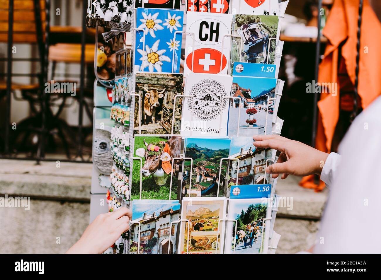 swiss souvenirs bells and magnets with post cards from switzerland ...