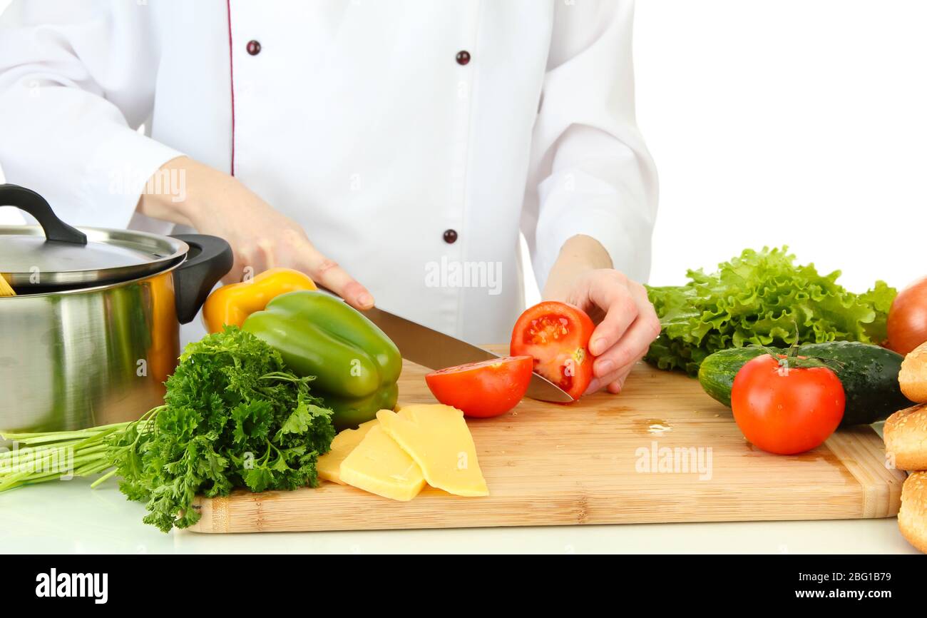 Female hands cutting vegetables, isolated on white Stock Photo - Alamy