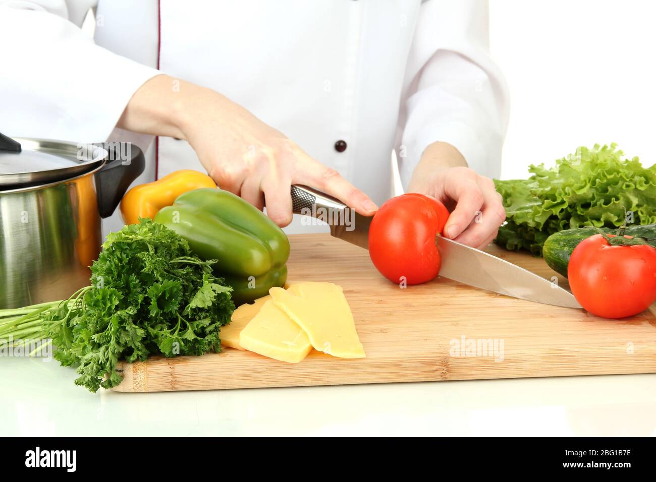 Female hands cutting vegetables, isolated on white Stock Photo - Alamy