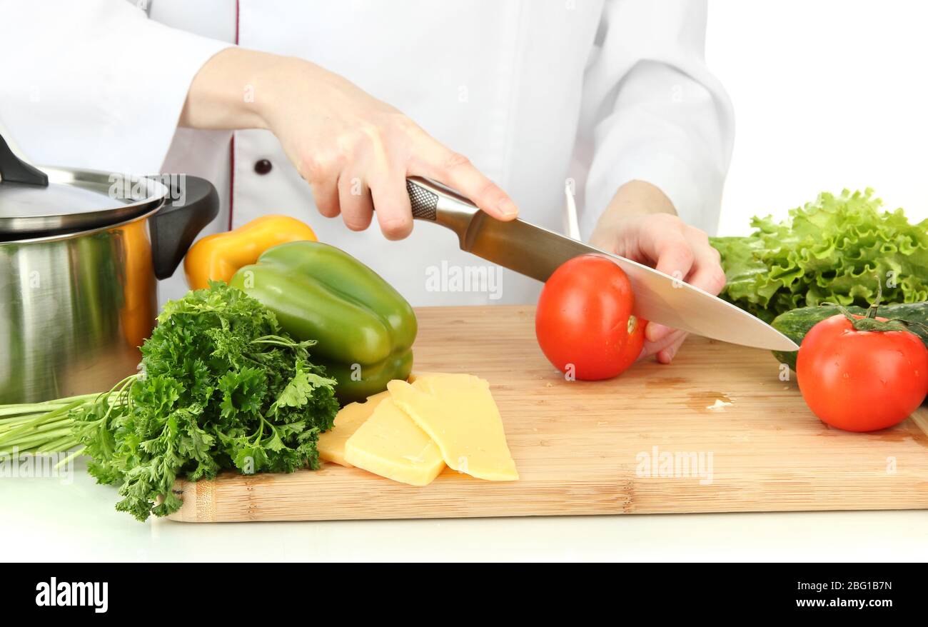Female hands cutting vegetables, isolated on white Stock Photo - Alamy