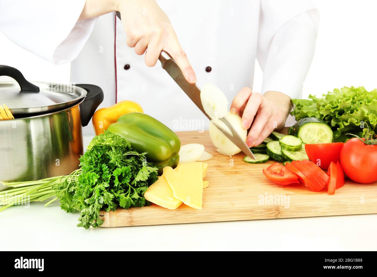 Female hands cutting vegetables, isolated on white Stock Photo - Alamy