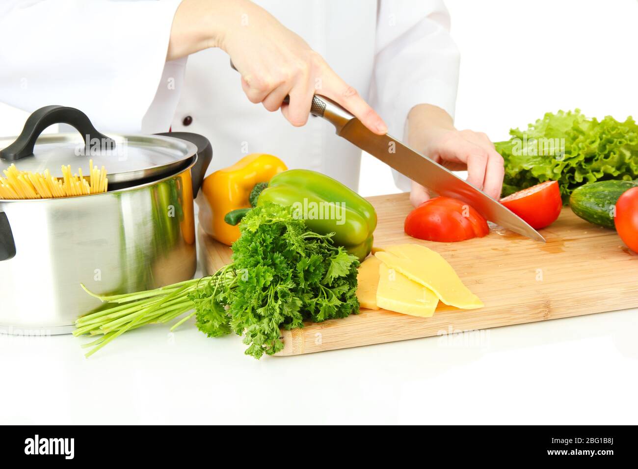 Female hands cutting vegetables, isolated on white Stock Photo - Alamy