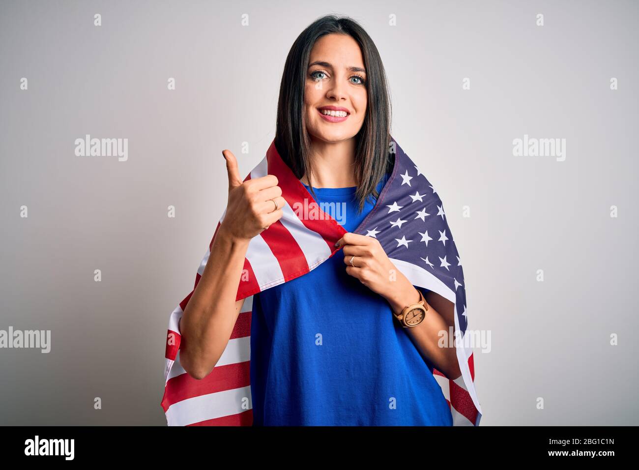 Young brunette patriotic woman with blue eyes wearing united states of ...