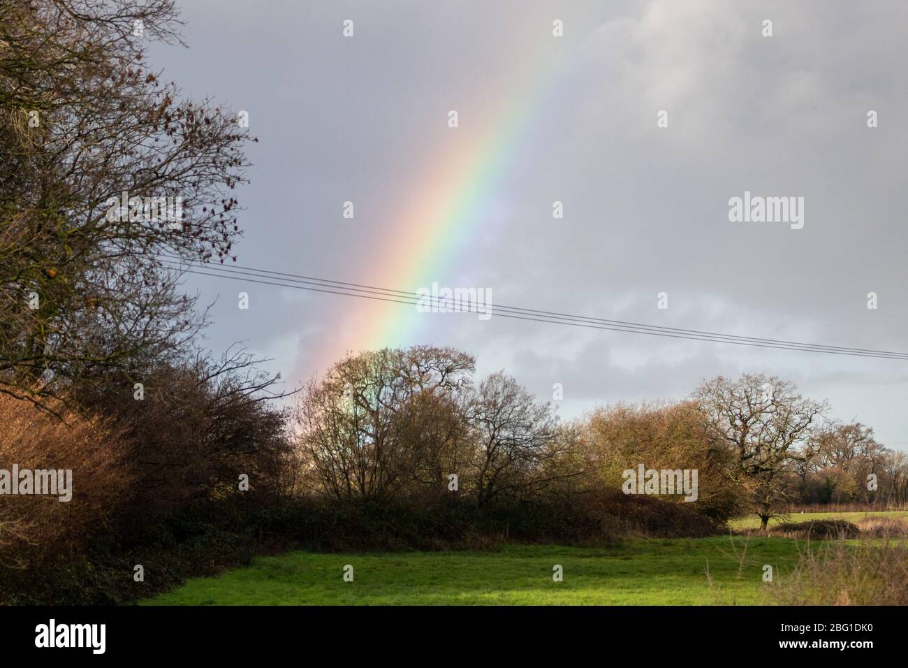 A rainbow in the English countryside Stock Photo - Alamy