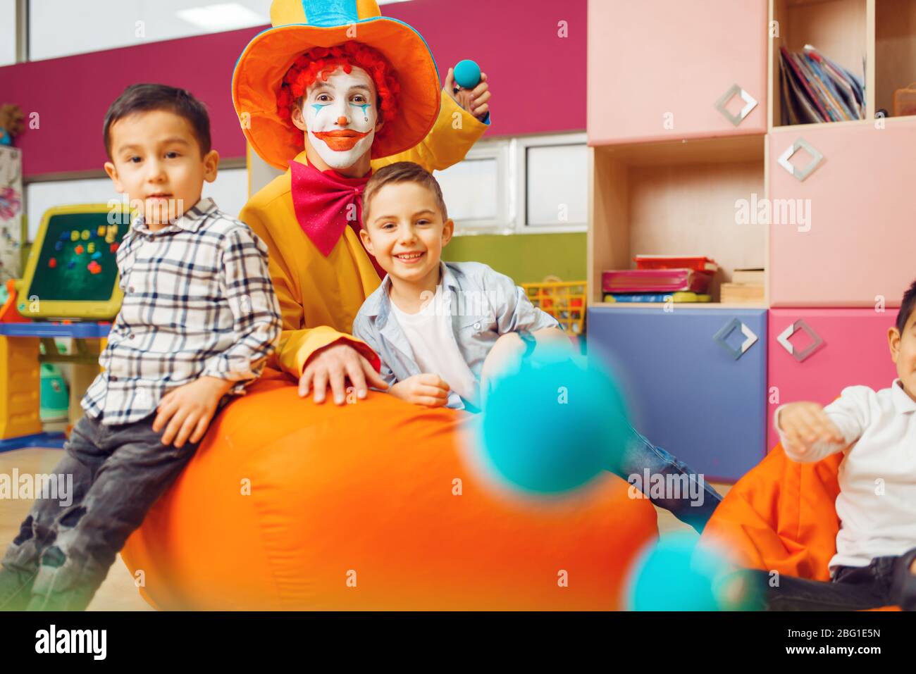 Funny clown with little boy in kindergarten Stock Photo - Alamy