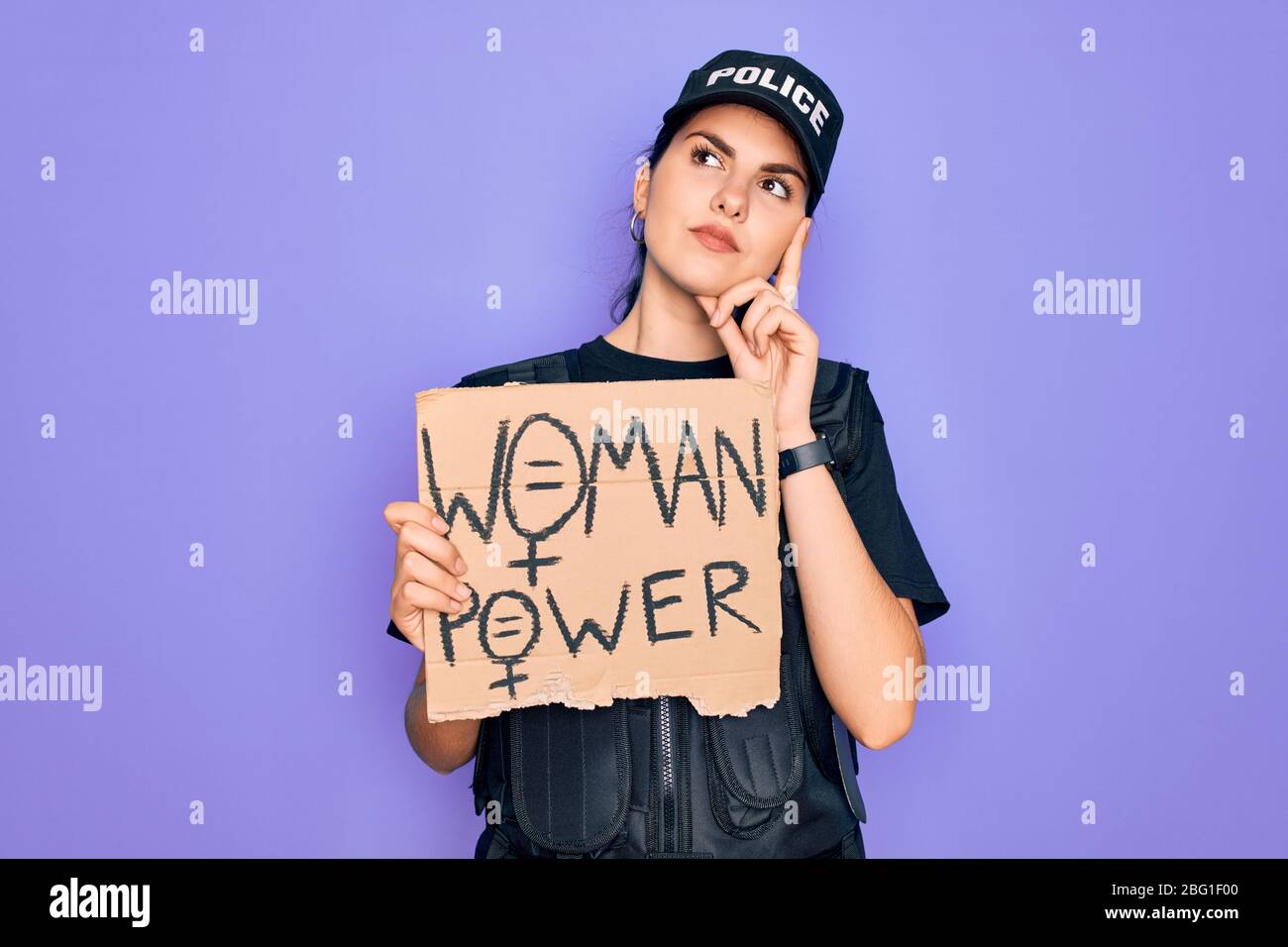 Police woman wearing security bulletproof vest uniform holding woman ...