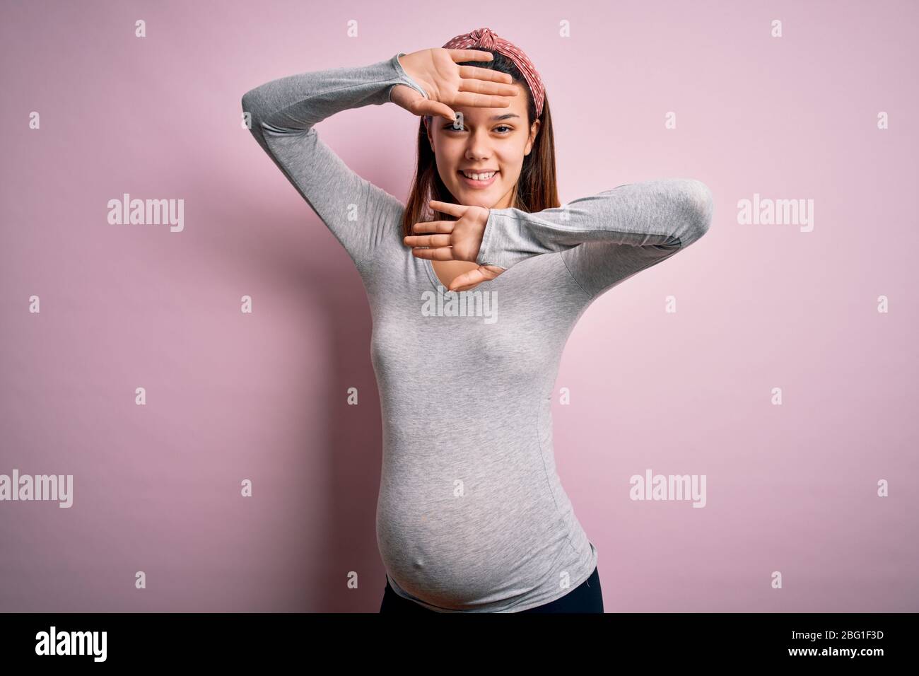 Young beautiful teenager girl pregnant expecting baby over isolated ...