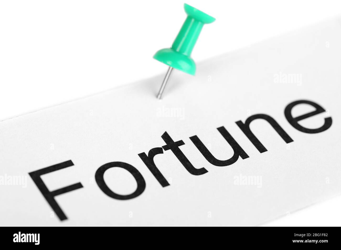 Push pin on paper with word fortune written on it isolated on white ...