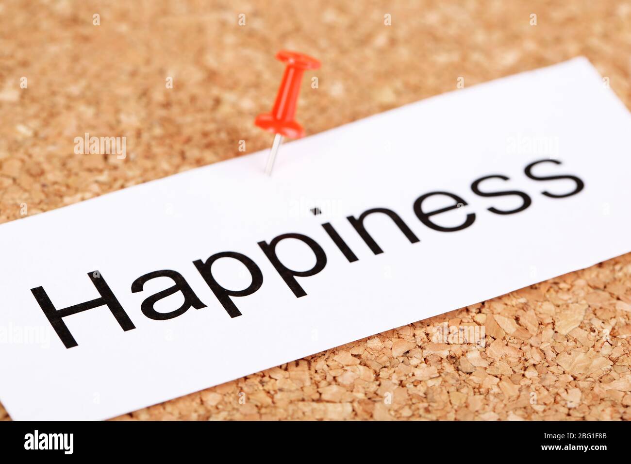 Push pin on paper with word happiness on cork board Stock Photo - Alamy