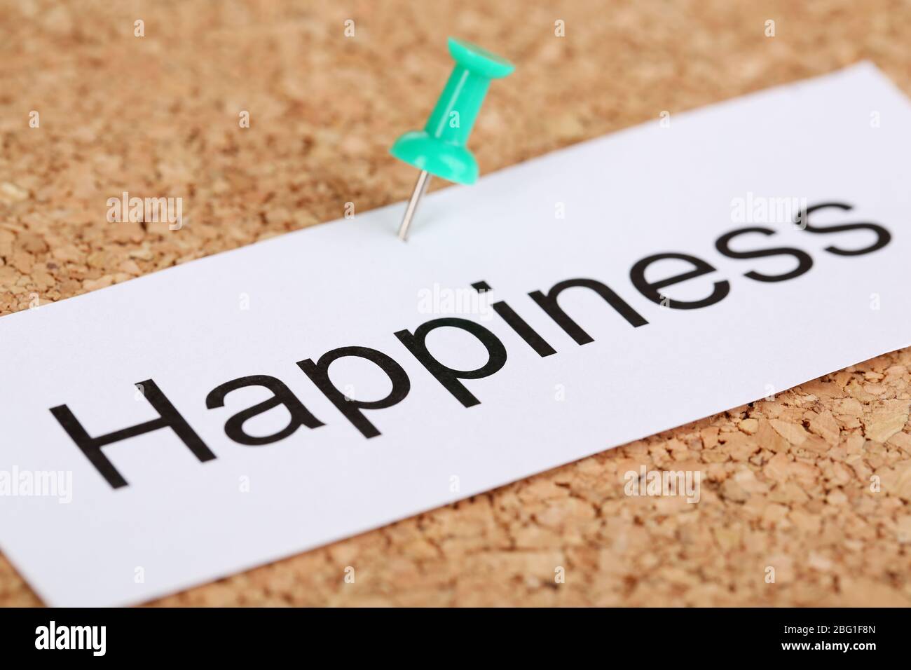 Push pin on paper with word happiness on cork board Stock Photo - Alamy