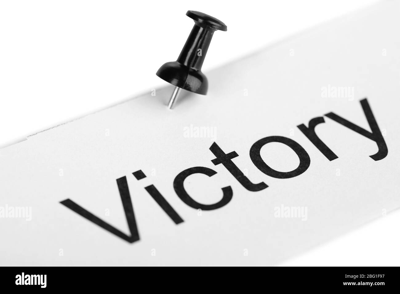 Push pin on paper with word victory written on it isolated on white ...