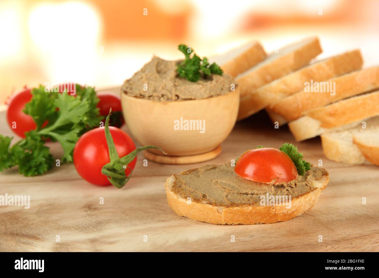 Composition of fresh pate, tomatoes and bread, on bright background ...