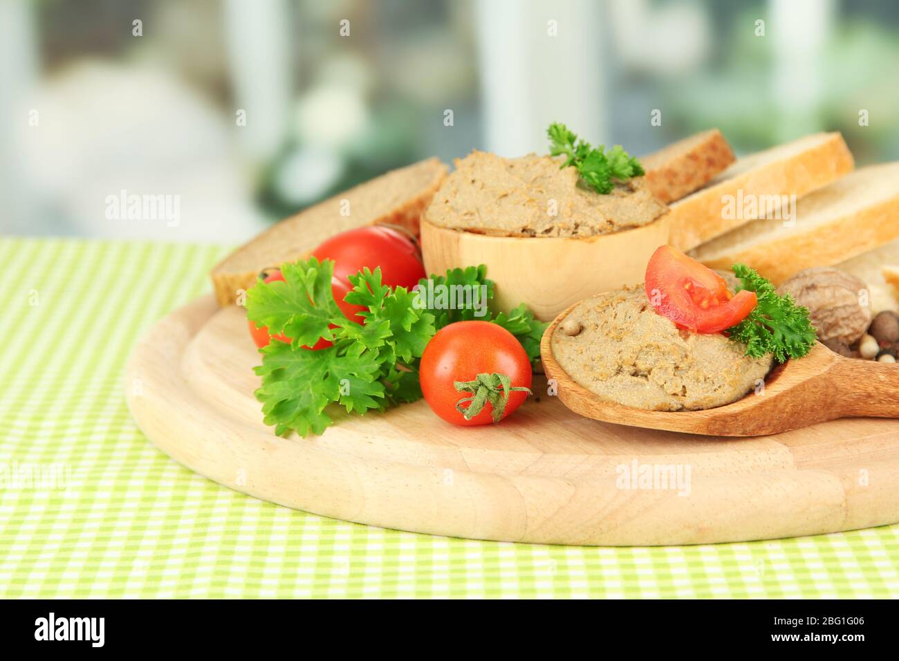 Composition of fresh pate, tomatoes and bread, on bright background ...