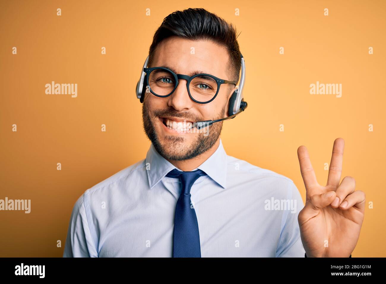 Young business operator man wearing customer service headset from call ...