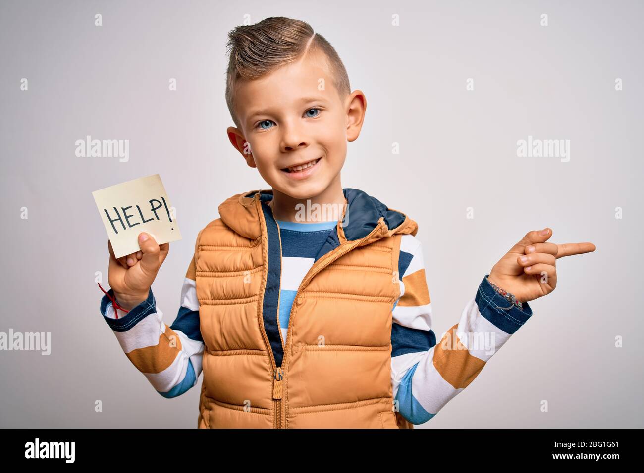 Young little caucasian kid asking for help on a paper note as violence ...