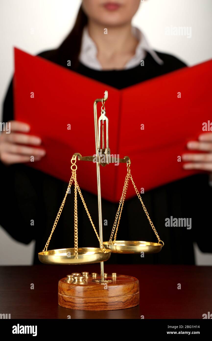 Judge read verdict on grey background Stock Photo - Alamy