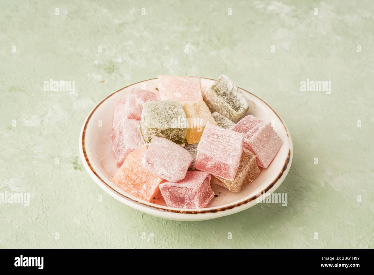 colorful assortment of Turkish delights on a green background Stock ...