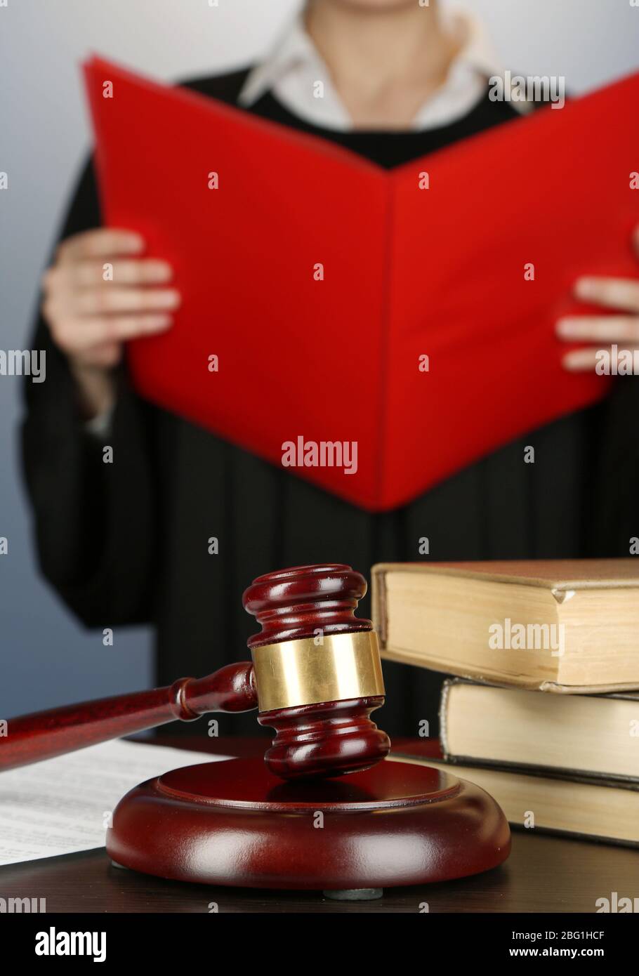 Judge read verdict on purple background Stock Photo - Alamy