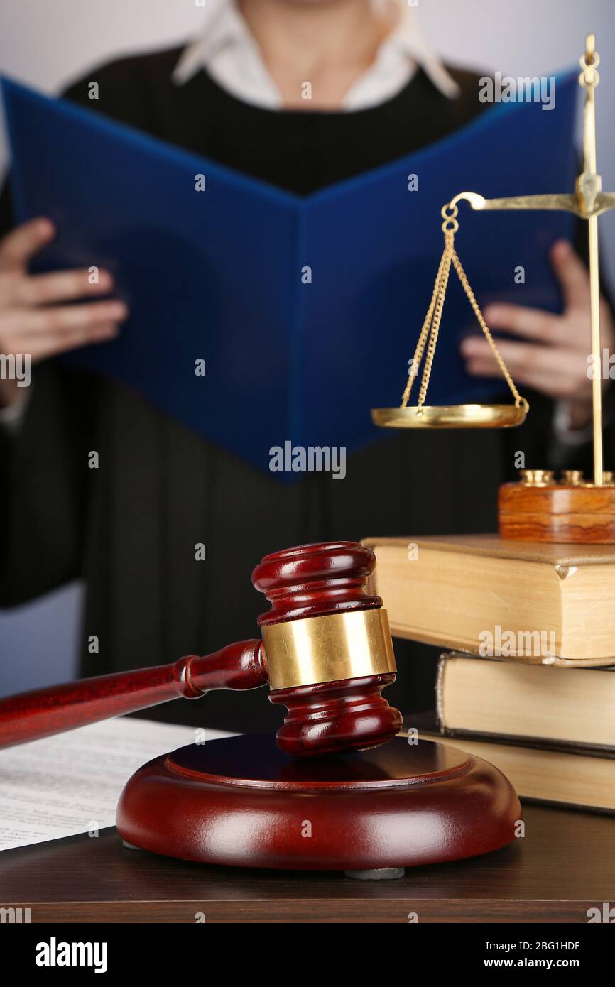 Judge read verdict on purple background Stock Photo - Alamy