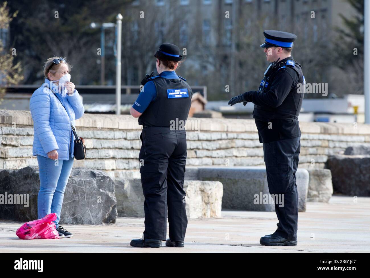 Police Community Support Officers assist a resident in Weston-super ...