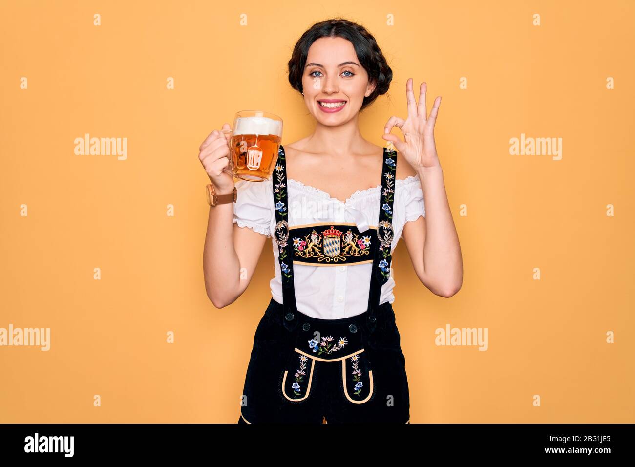 Beautiful german woman with blue eyes wearing traditional octoberfest ...