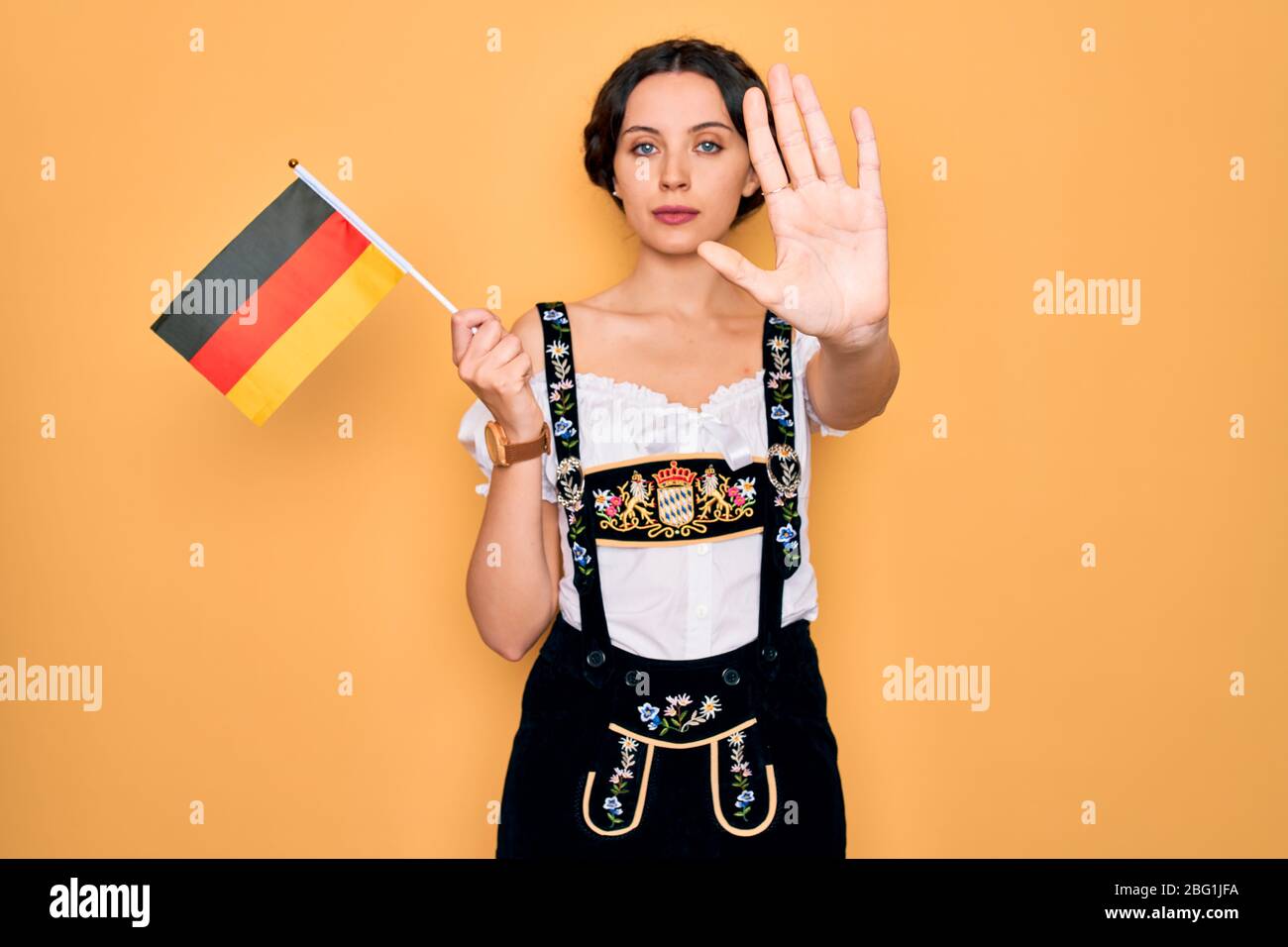 Young patriotic german woman with blue eyes wearing octoberfest dress ...