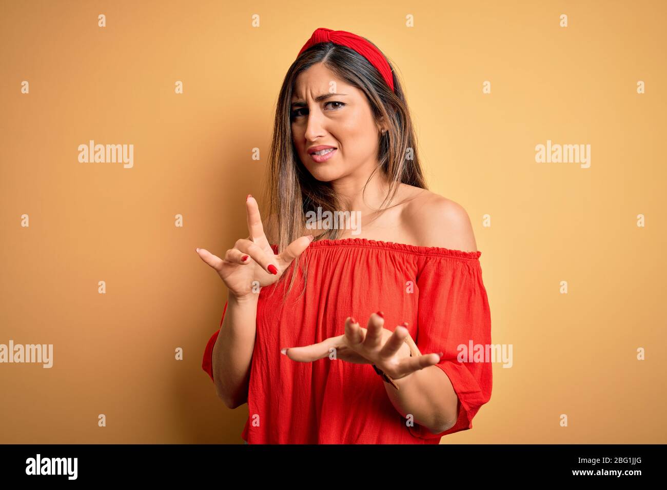 Young beautiful woman colorful summer style over yellow isolated ...