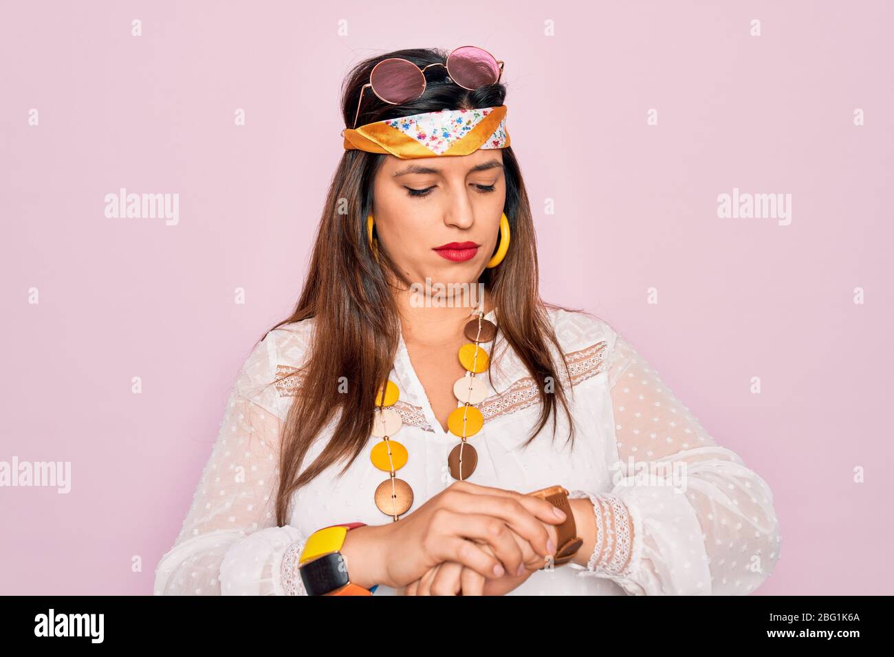 Young hispanic hippie woman wearing fashion boho style and sunglasses ...