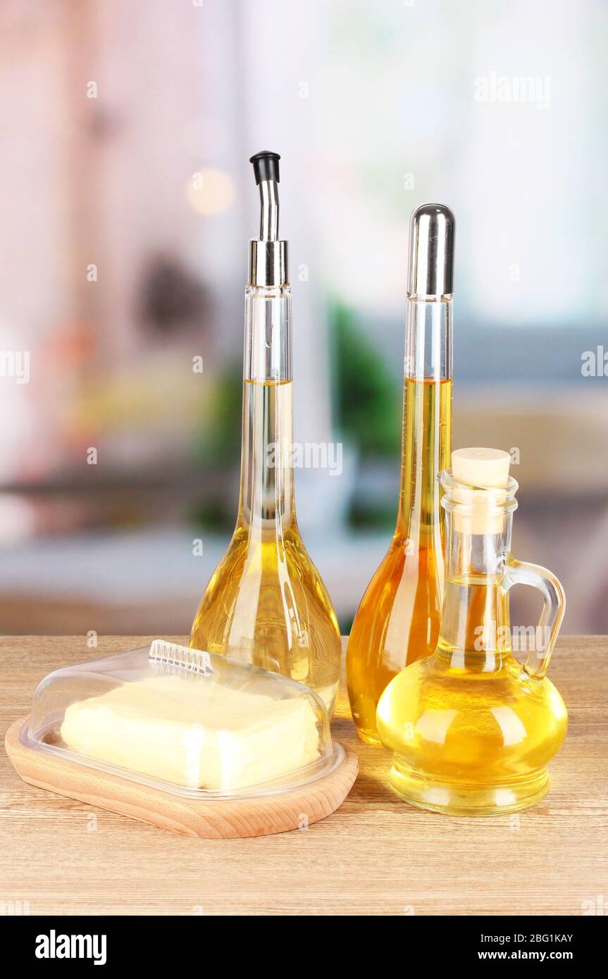 Different types of oil on table in kitchen Stock Photo - Alamy