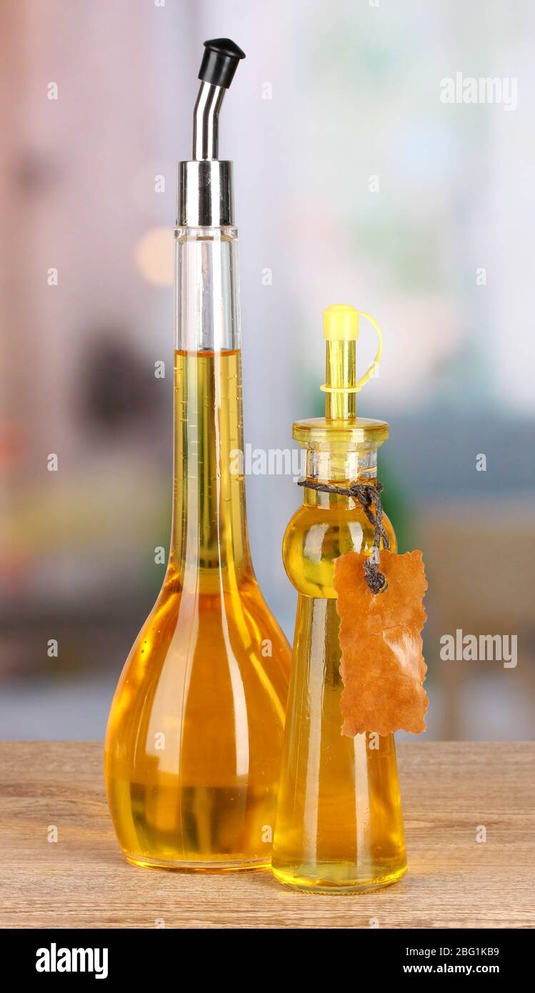 Different types of oil on table in kitchen Stock Photo - Alamy