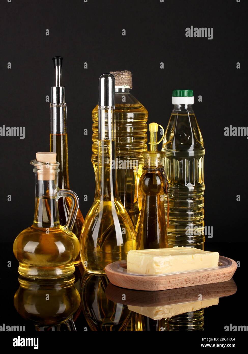 Different types of oil on dark background Stock Photo - Alamy