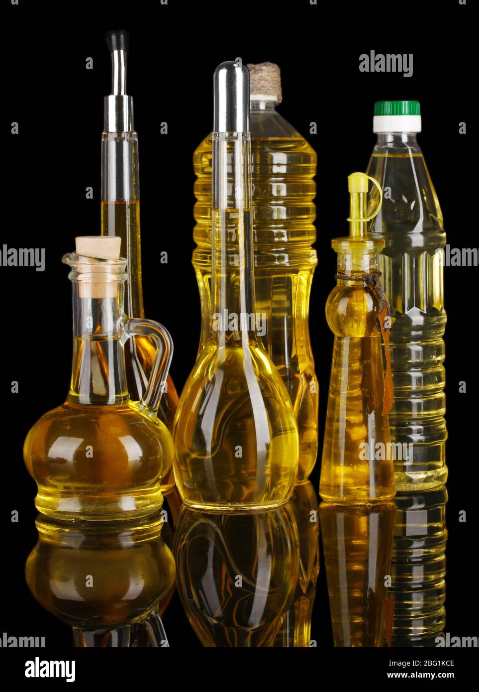Different types of oil on dark background Stock Photo - Alamy