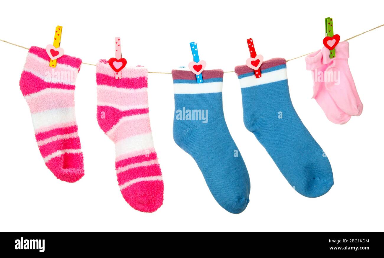 Colorful socks hanging on clothesline, isolated on white Stock Photo ...