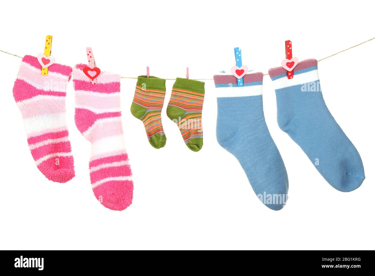 Colorful socks hanging on clothesline, isolated on white Stock Photo ...