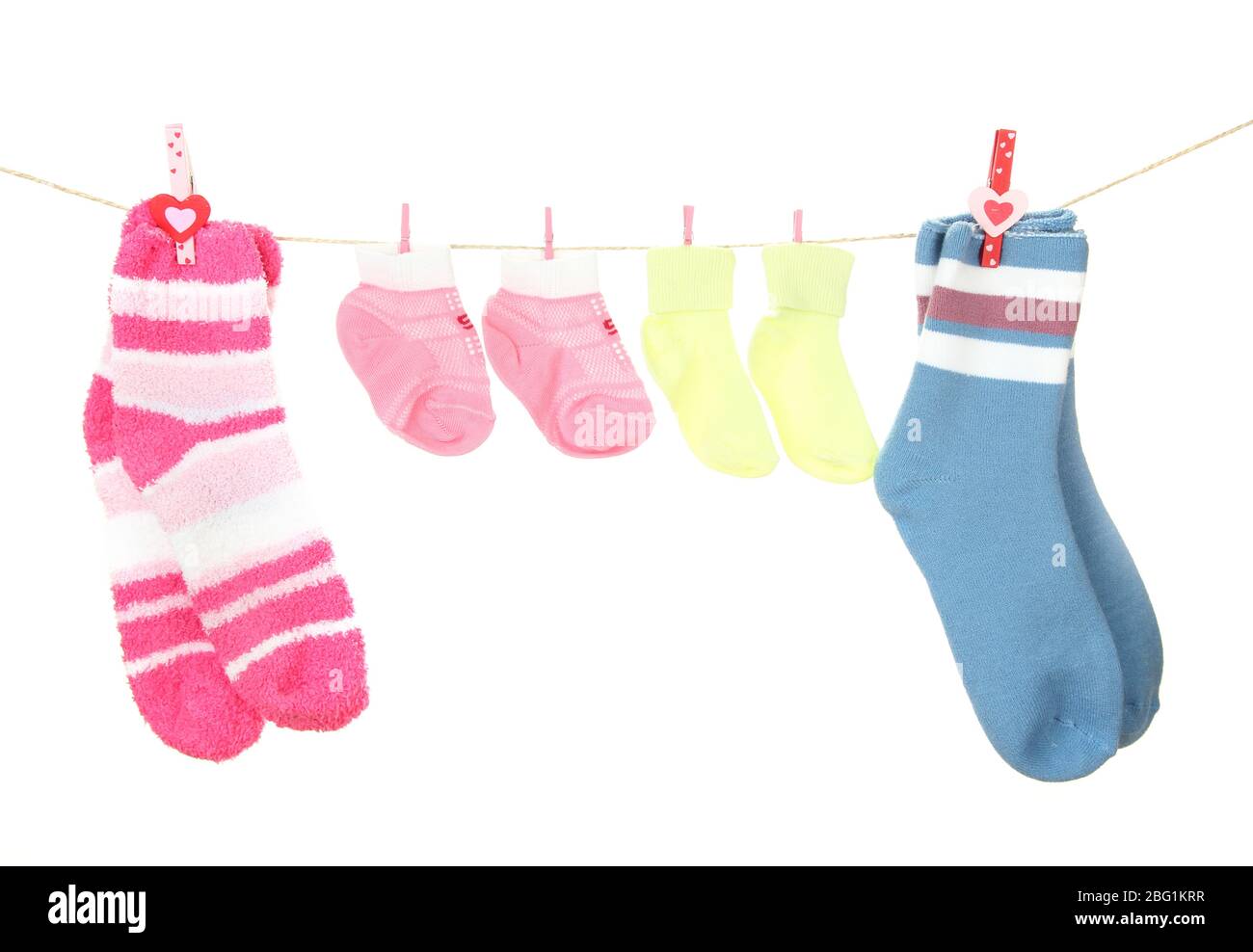 Colorful socks hanging on clothesline, isolated on white Stock Photo ...