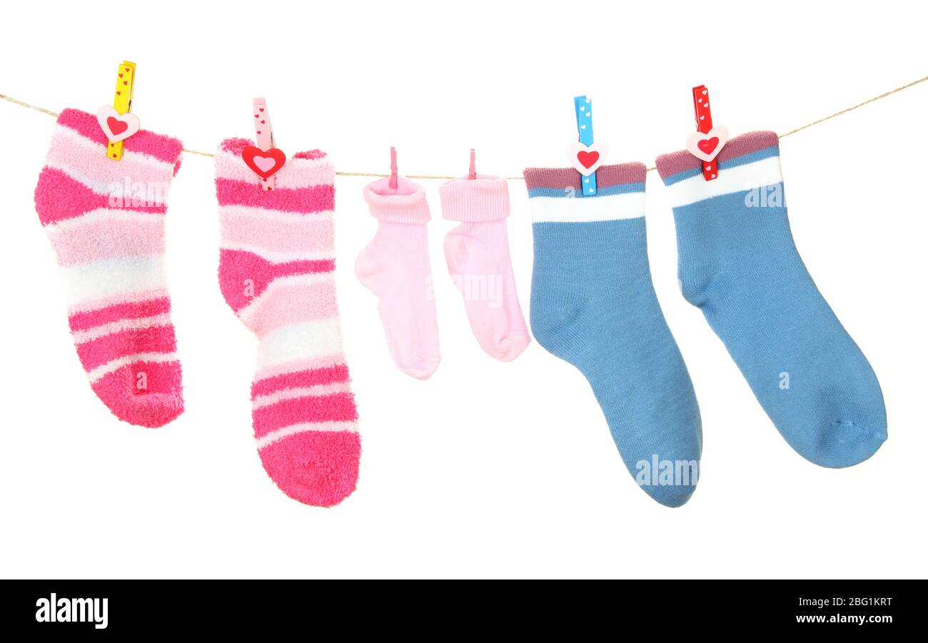 Colorful socks hanging on clothesline, isolated on white Stock Photo ...