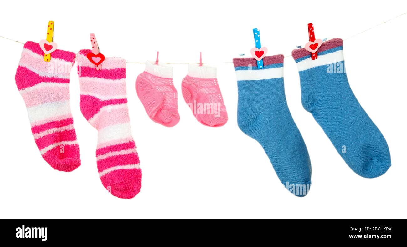 Colorful socks hanging on clothesline, isolated on white Stock Photo ...