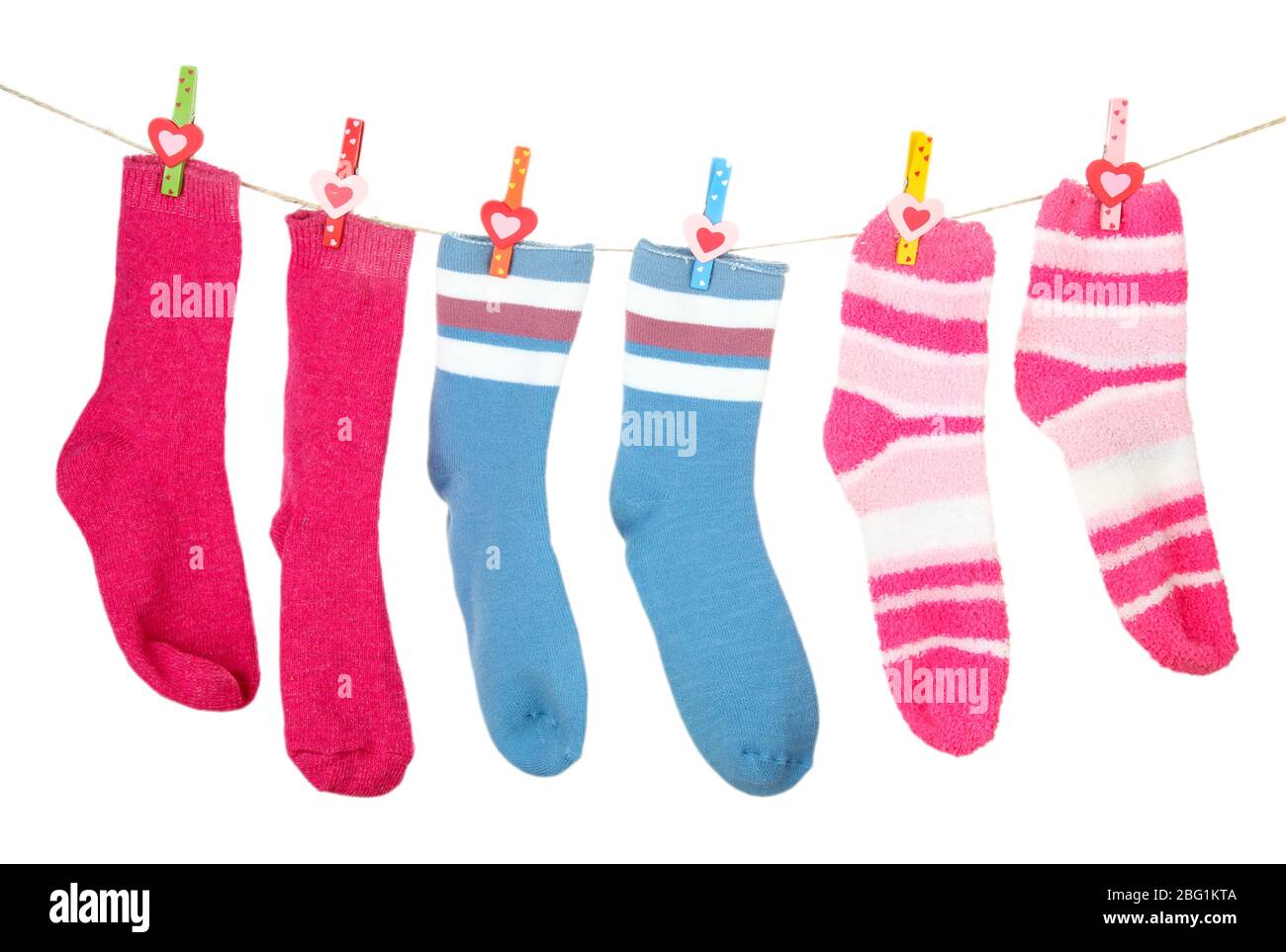 Colorful socks hanging on clothesline, isolated on white Stock Photo ...