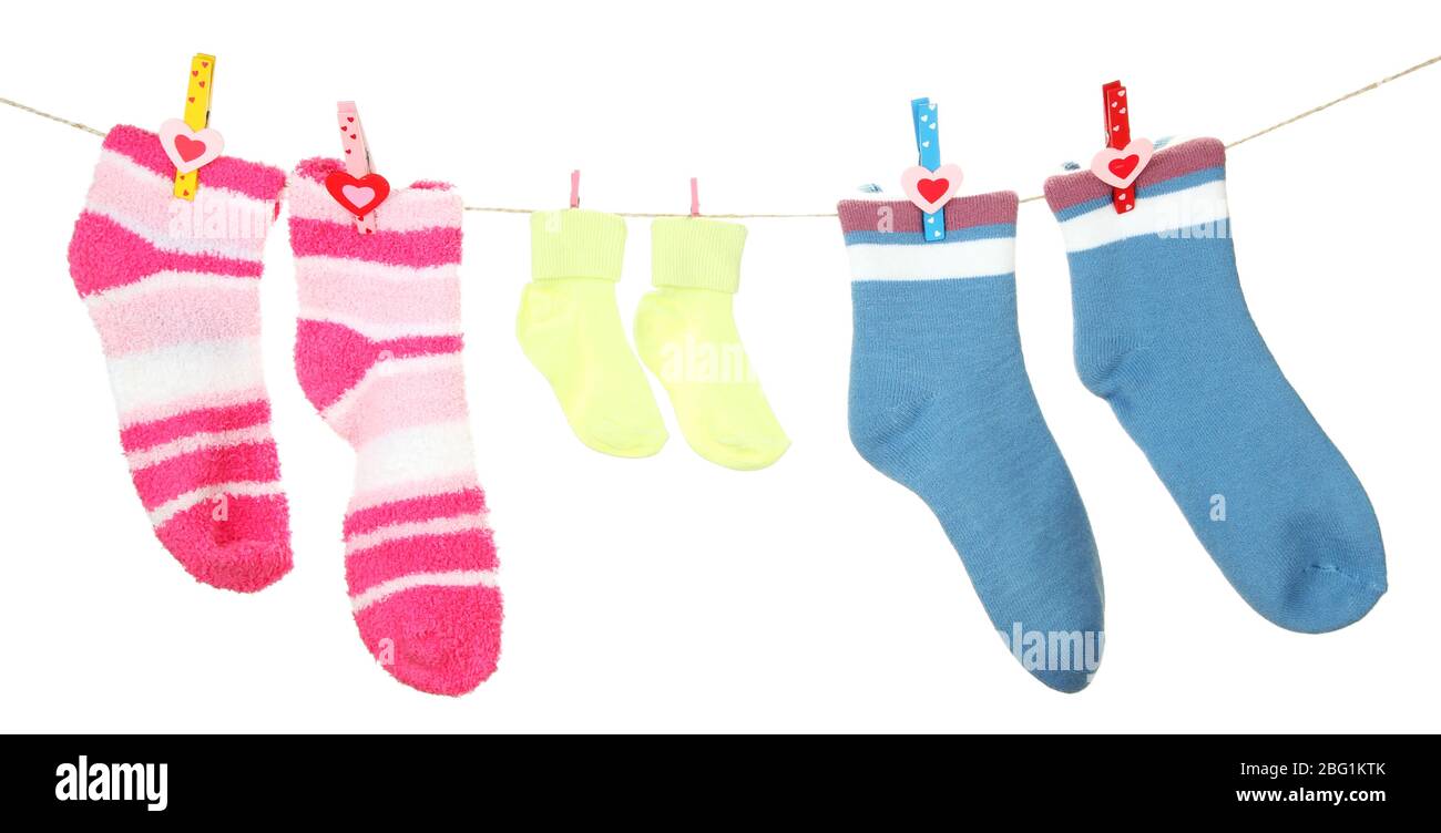Colorful socks hanging on clothesline, isolated on white Stock Photo ...