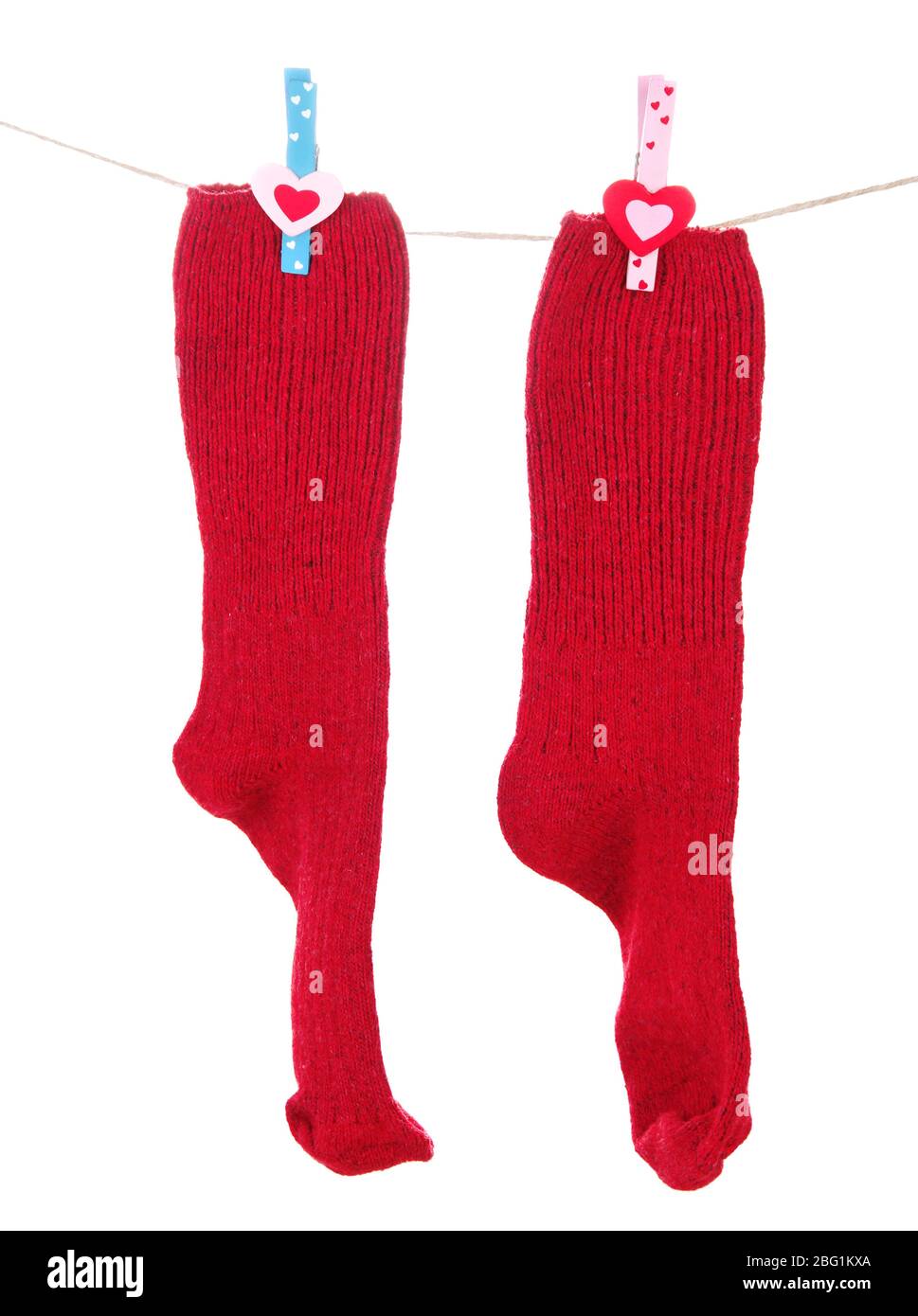 Colorful socks hanging on clothesline, isolated on white Stock Photo ...