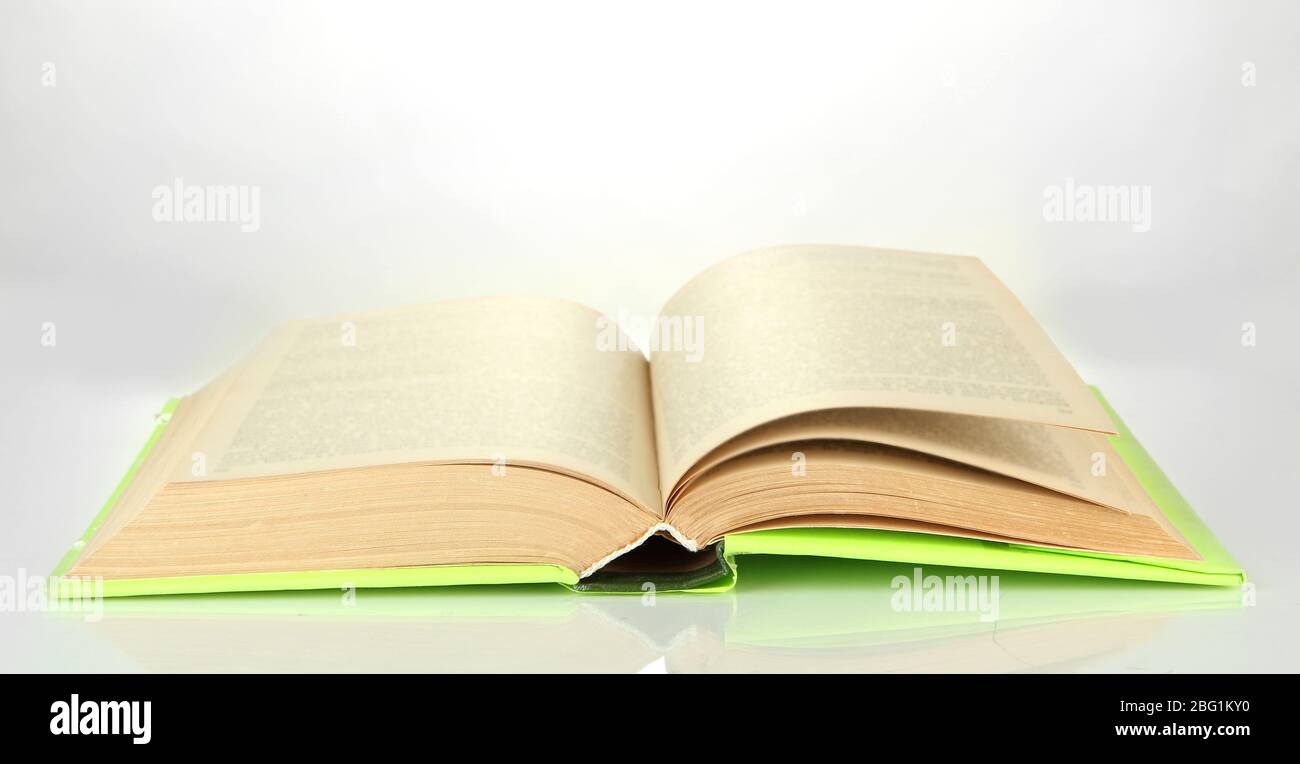 Opened book isolated on white Stock Photo - Alamy