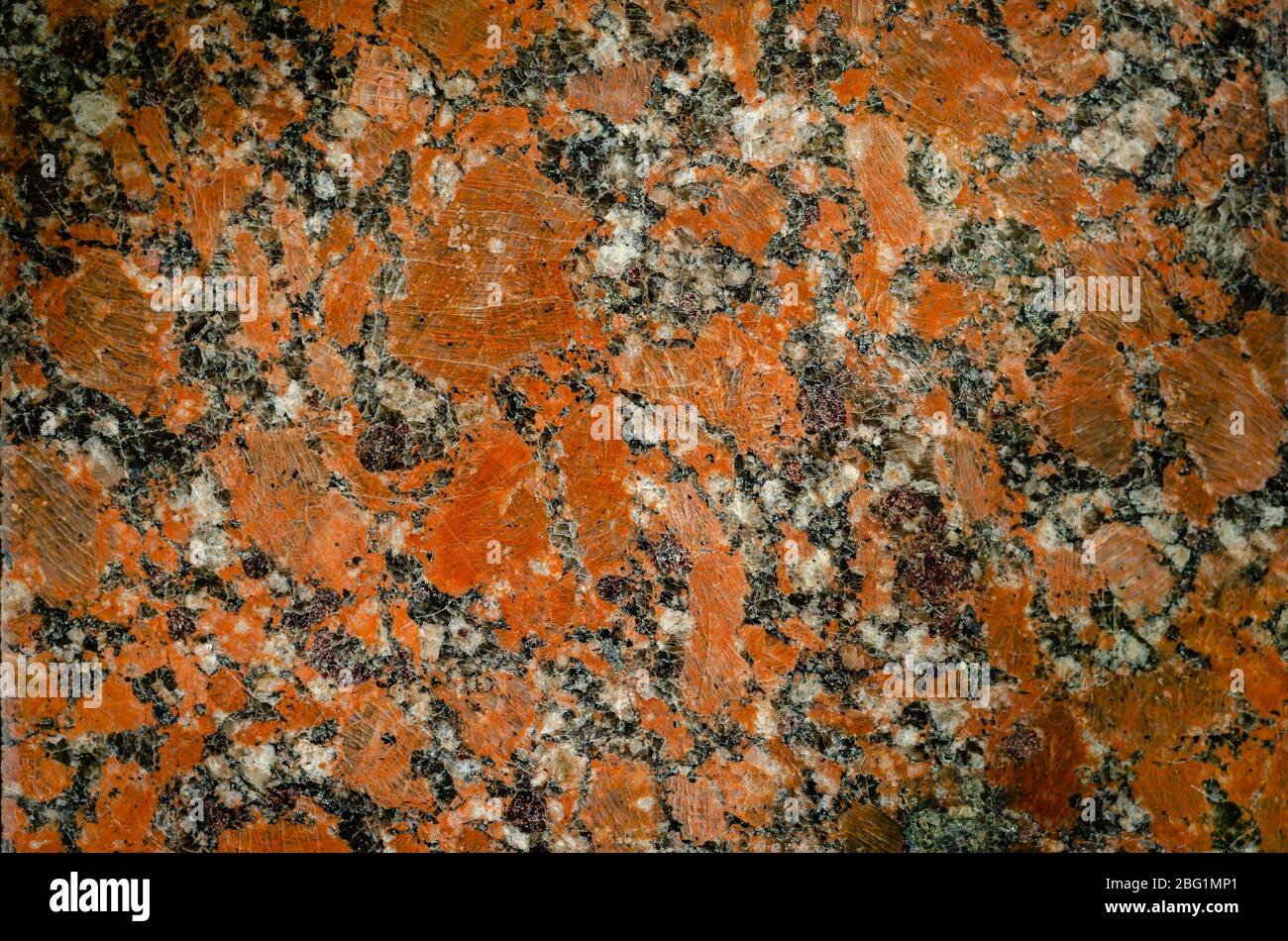 Red granite background. The texture of the old granite. Red polished ...