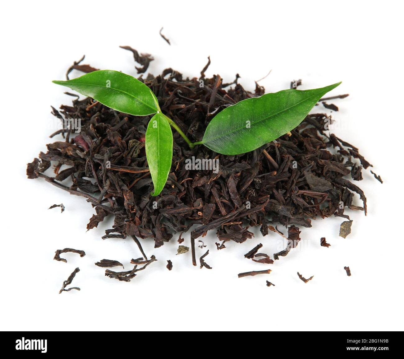 Dry black tea with green leaves, isolated on white Stock Photo - Alamy