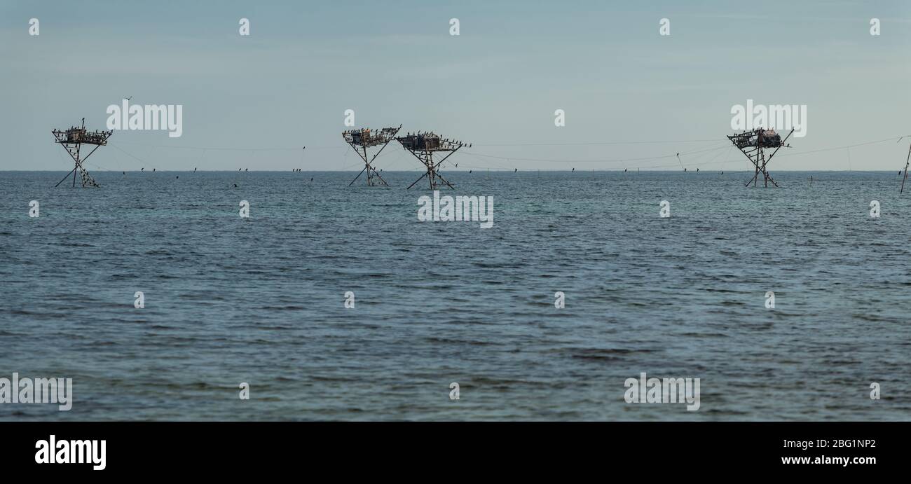 Fishing towers for catching mullet and other fish Stock Photo - Alamy