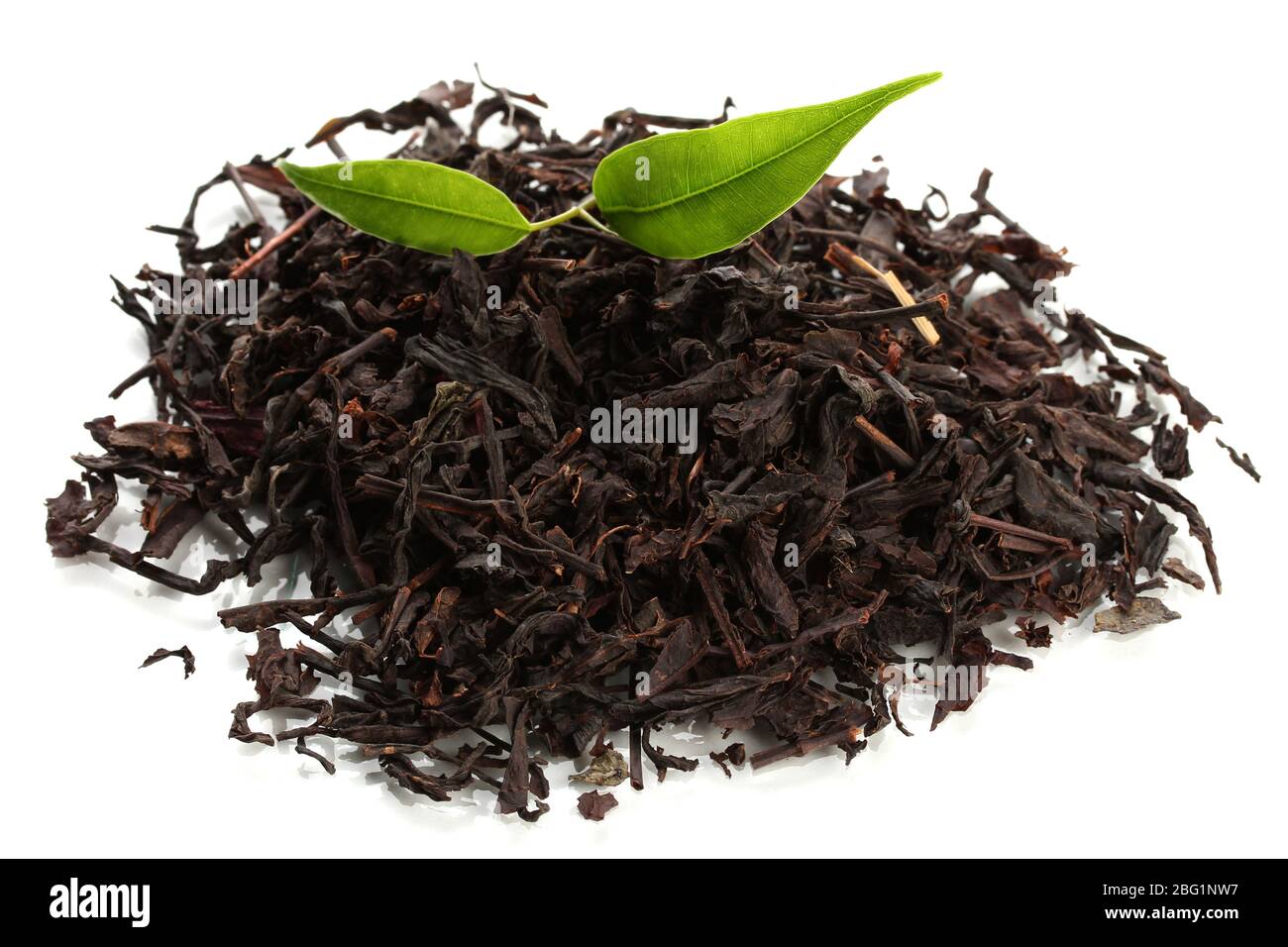 Dry black tea with green leaves, isolated on white Stock Photo - Alamy