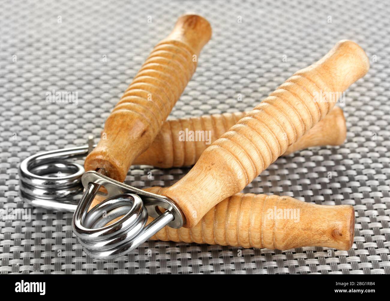 Modern hand trainer on grey background Stock Photo - Alamy