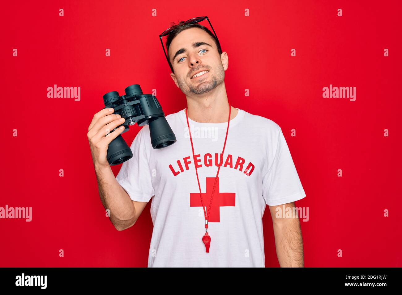 Man wearing lifeguard shirt standing hi-res stock photography and ...