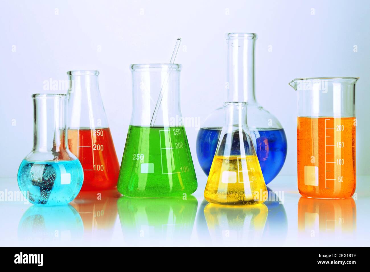 Test tubes with colorful liquids isolated on white Stock Photo - Alamy