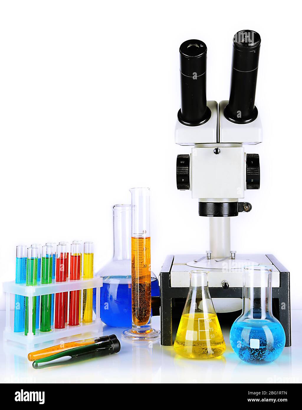 Test tubes with colorful liquids and microscope isolated on white Stock ...